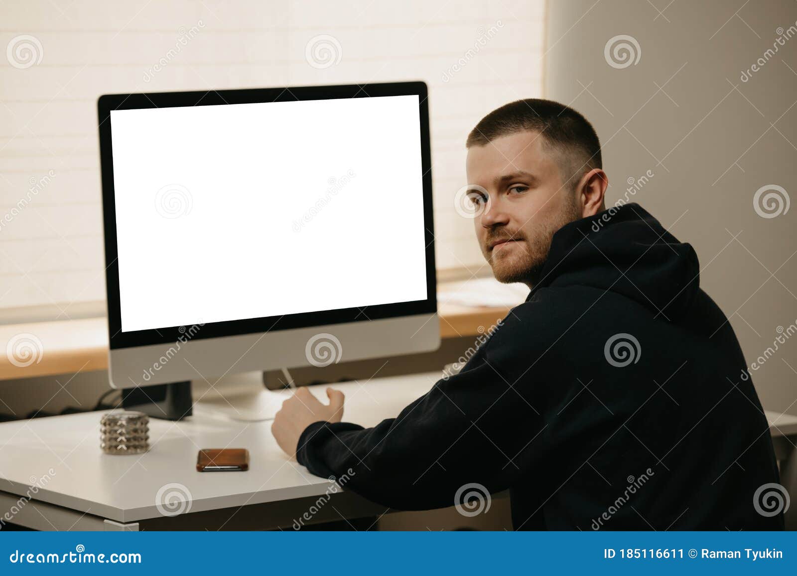 A Back View of a Businessman Works Remotely Using an All-in-one ...