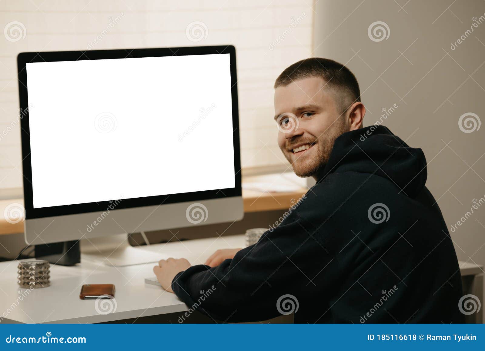 A Back View of a Businessman Works Remotely Using an All-in-one ...