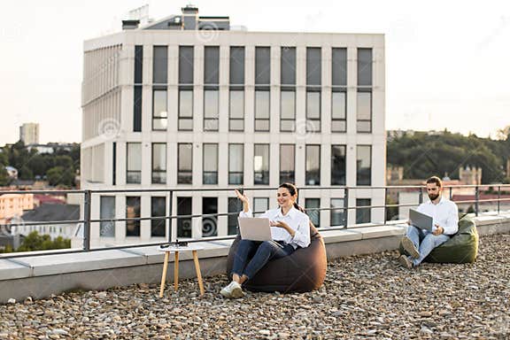 Remote Work on Rooftop with Modern Cityscape Background Stock Image ...