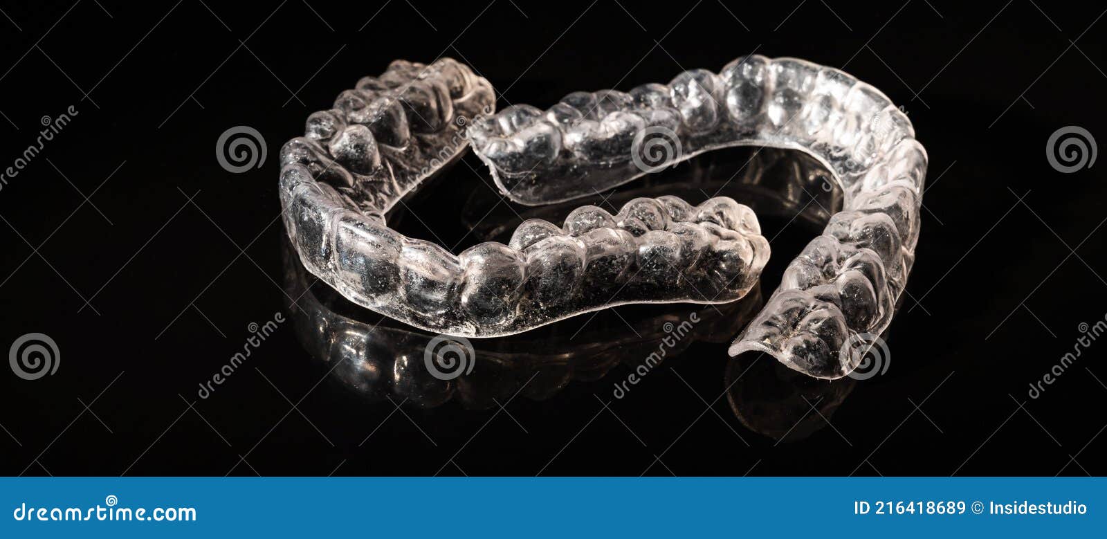 Removable Plastic Retainers for Bite Correction on a Black Background ...