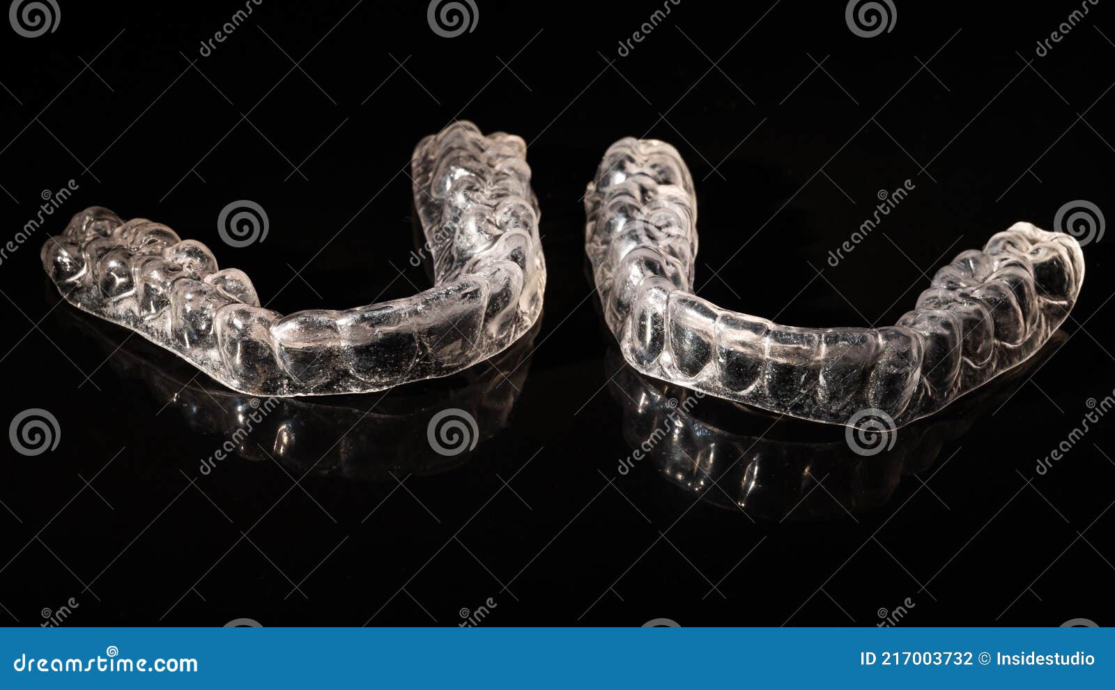 Removable Plastic Retainers for Bite Correction on a Black Background ...