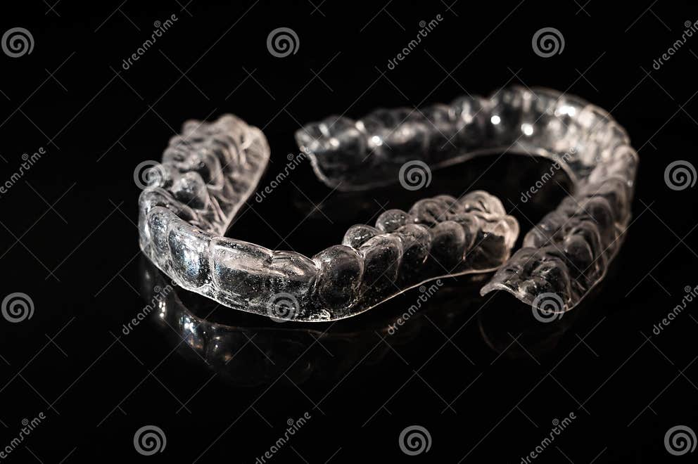 Removable Plastic Retainers on Black Background Stock Photo - Image of ...