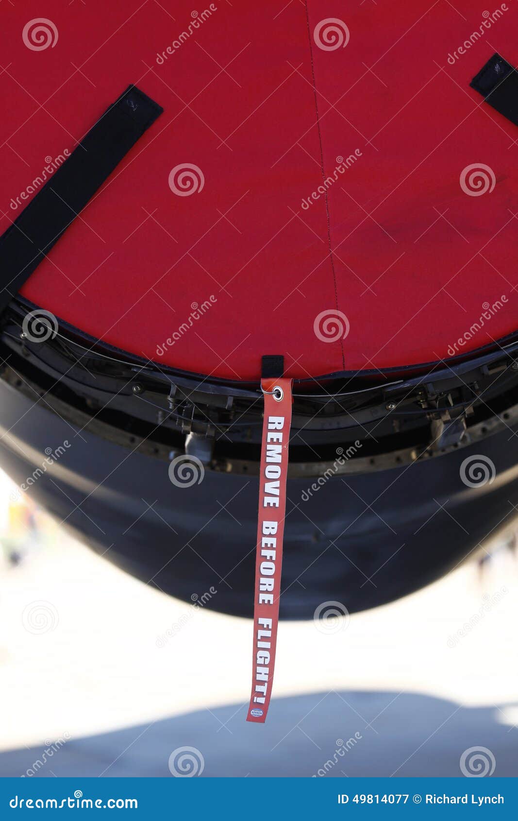 Remove Before Flight Red Ribbon Hanging Off Fighter Jet In Hangar ...