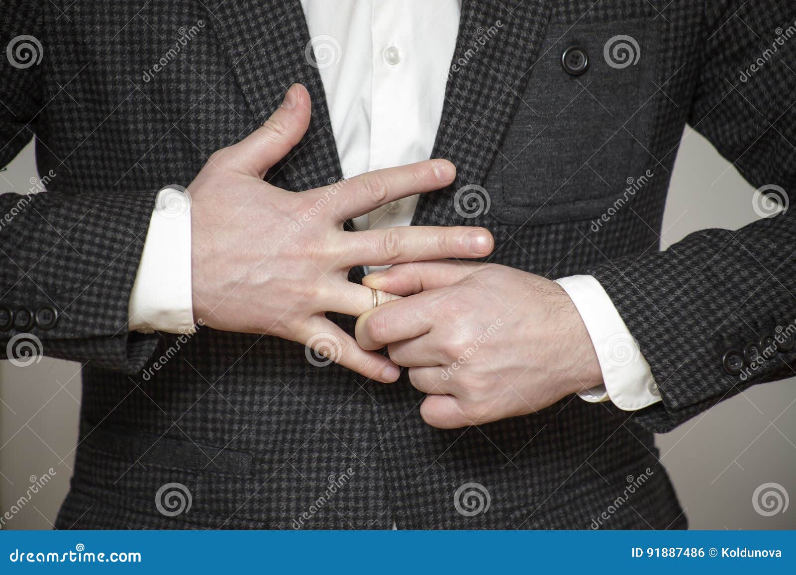 Remove Wedding Ring from His Finger Stock Photo - Image of background ...