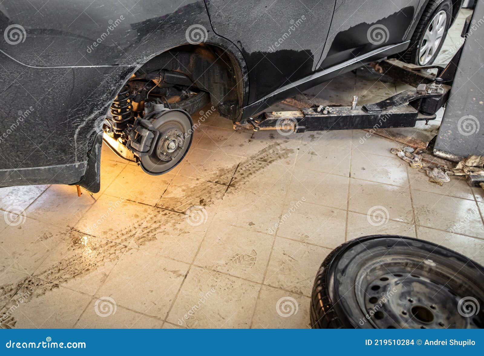 A Removed Wheel on a Car in a Technical Center. Stock Photo - Image of ...