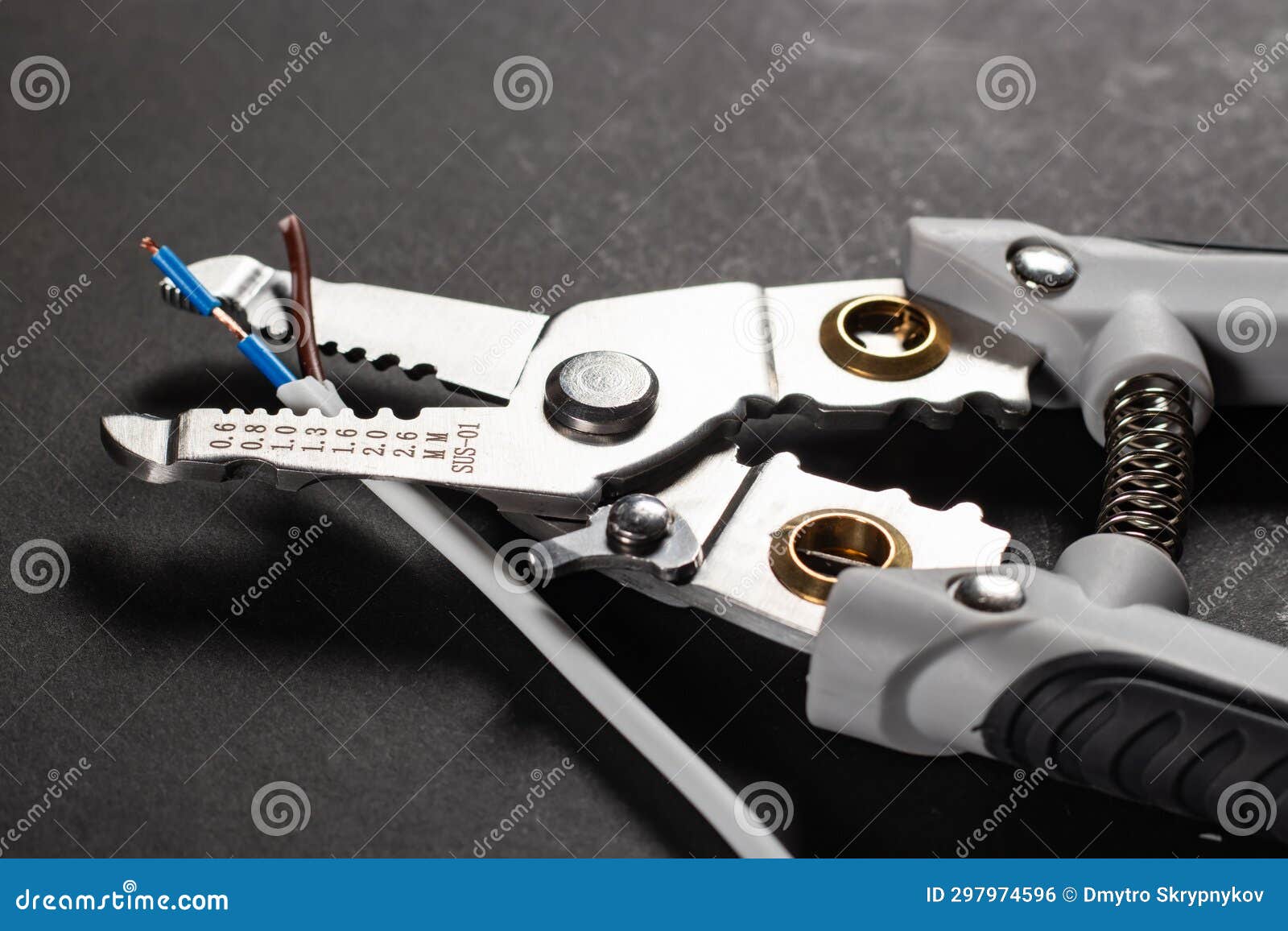 Removing the Insulation from the Conductor Using a Tool. Wire Stripping ...