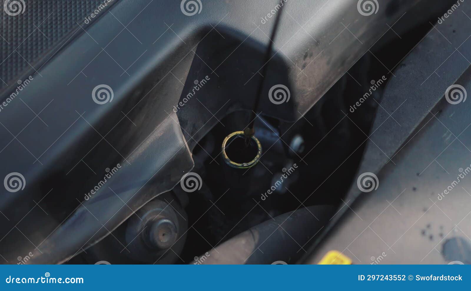 Removing the Oil Dipstick from the Engine To Check the Engine Oil Level ...