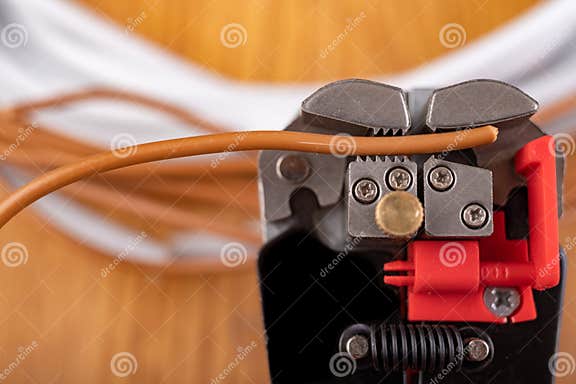 Removing Protective Insulation from Electrical Wires. Small Work in the ...