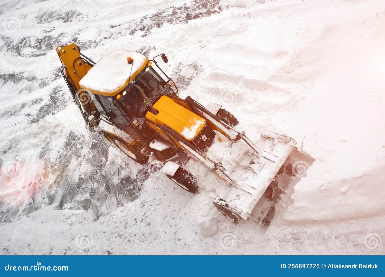 Removing Snow Accumulations Using a Tractor with Attachments Stock ...