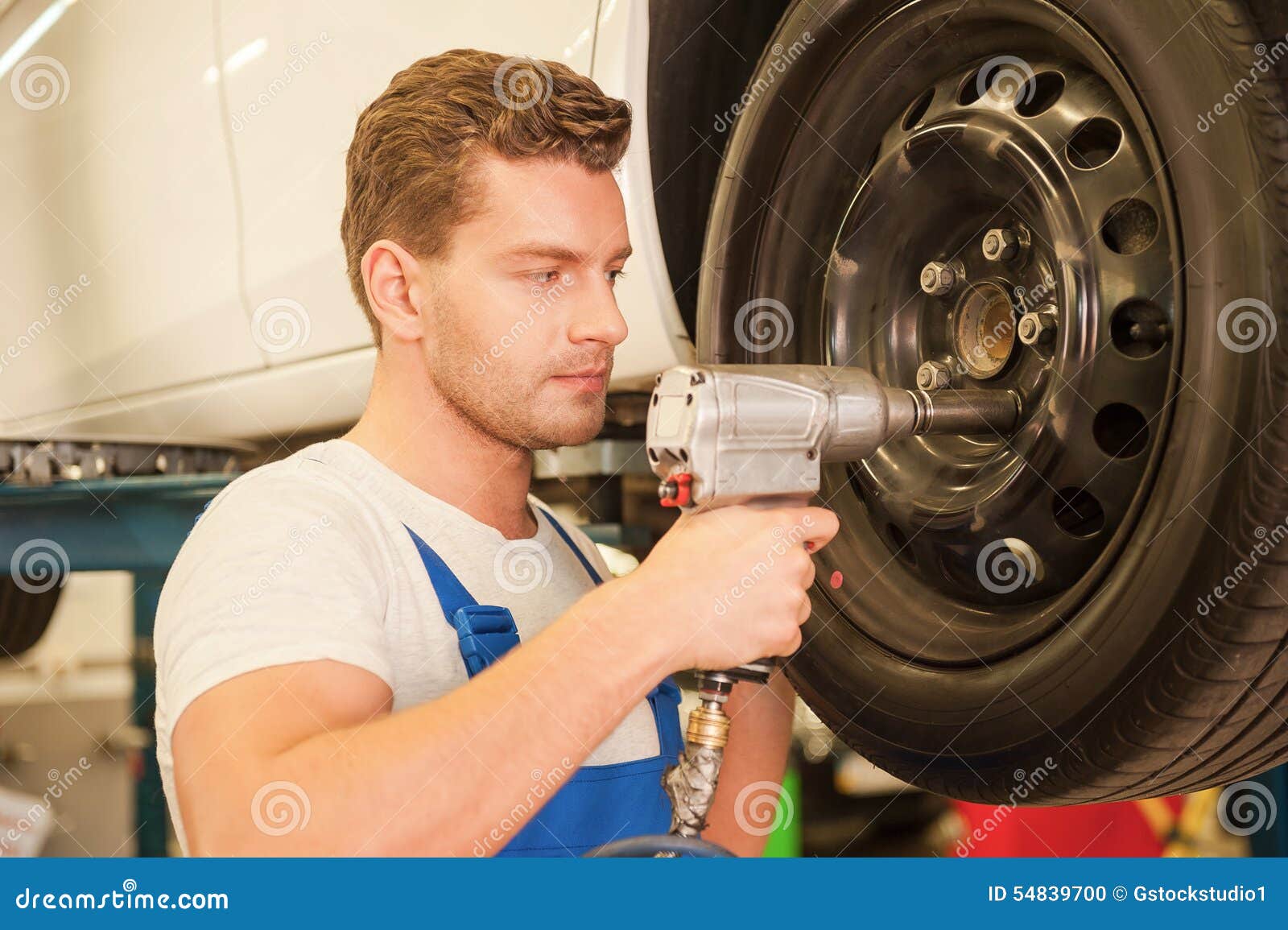 Removing tires. stock photo. Image of manual, tire, serious - 54839700