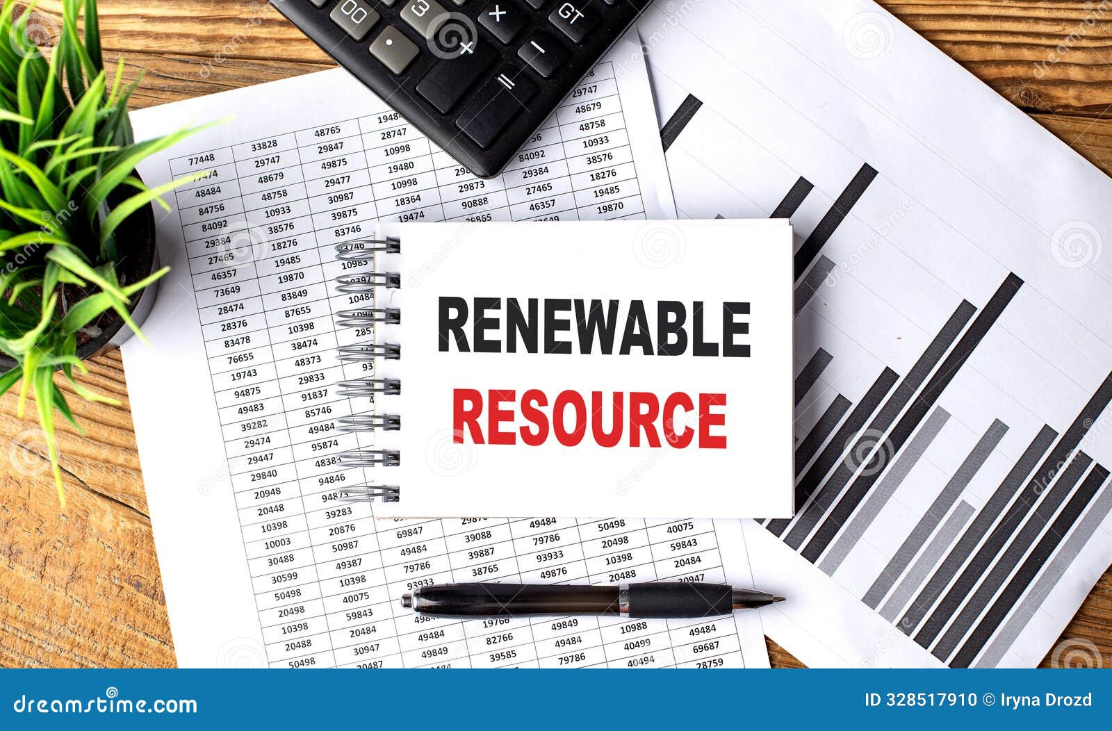 RENEWABLE RESOURCE Text on Notebook on Chart with Calculator and Pen ...