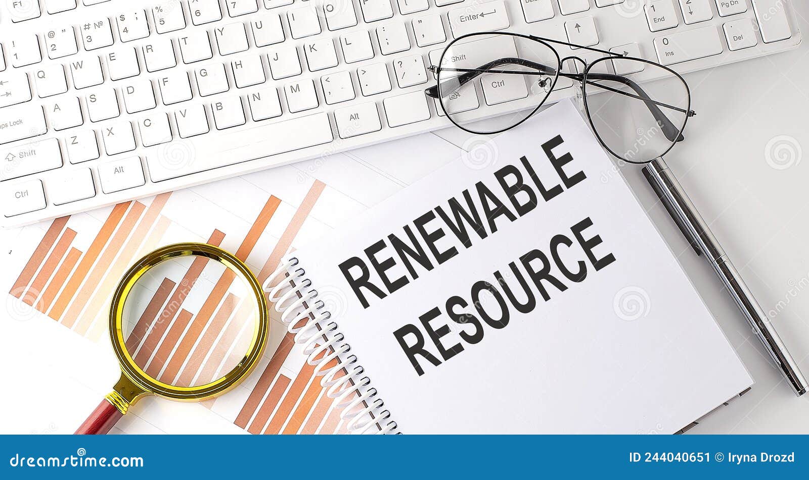 RENEWABLE RESOURCE Text Written on a Notebook with Keyboard, Chart,and ...