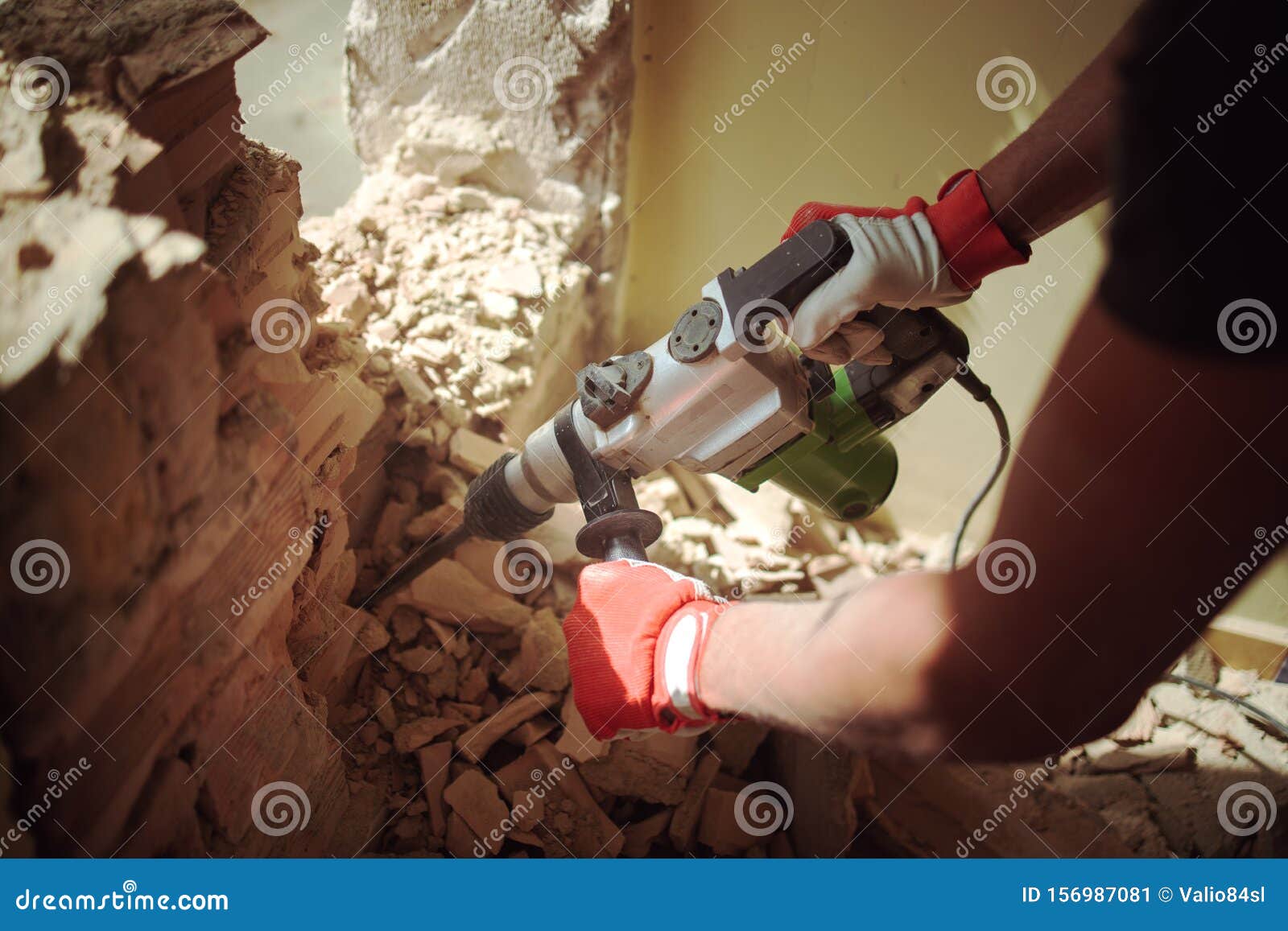 Renovation and Builder. Worker with Demolition Hammer Breaking Interior ...