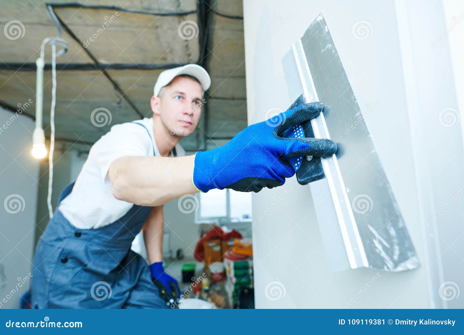 Refurbishment. Worker Spackling a Wall with Putty Stock Image - Image ...