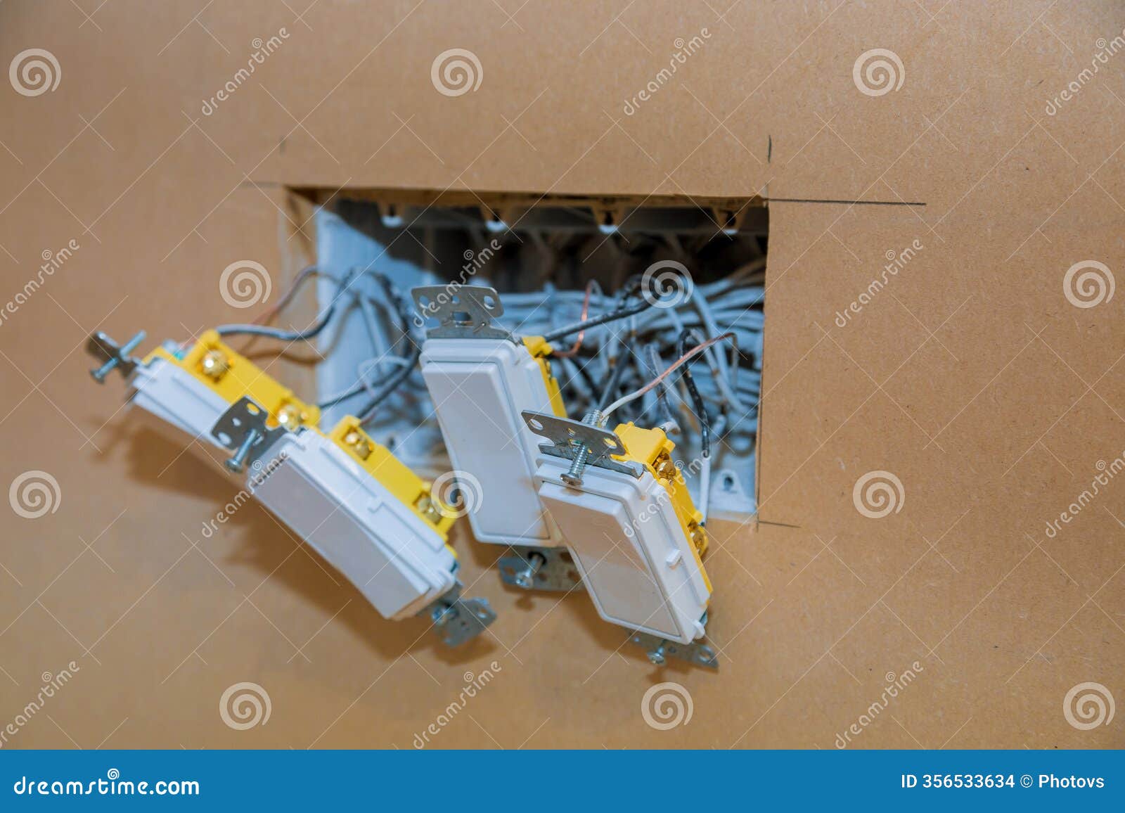 Three Electrical Switches Partially Installed in a Wall with Exposed ...