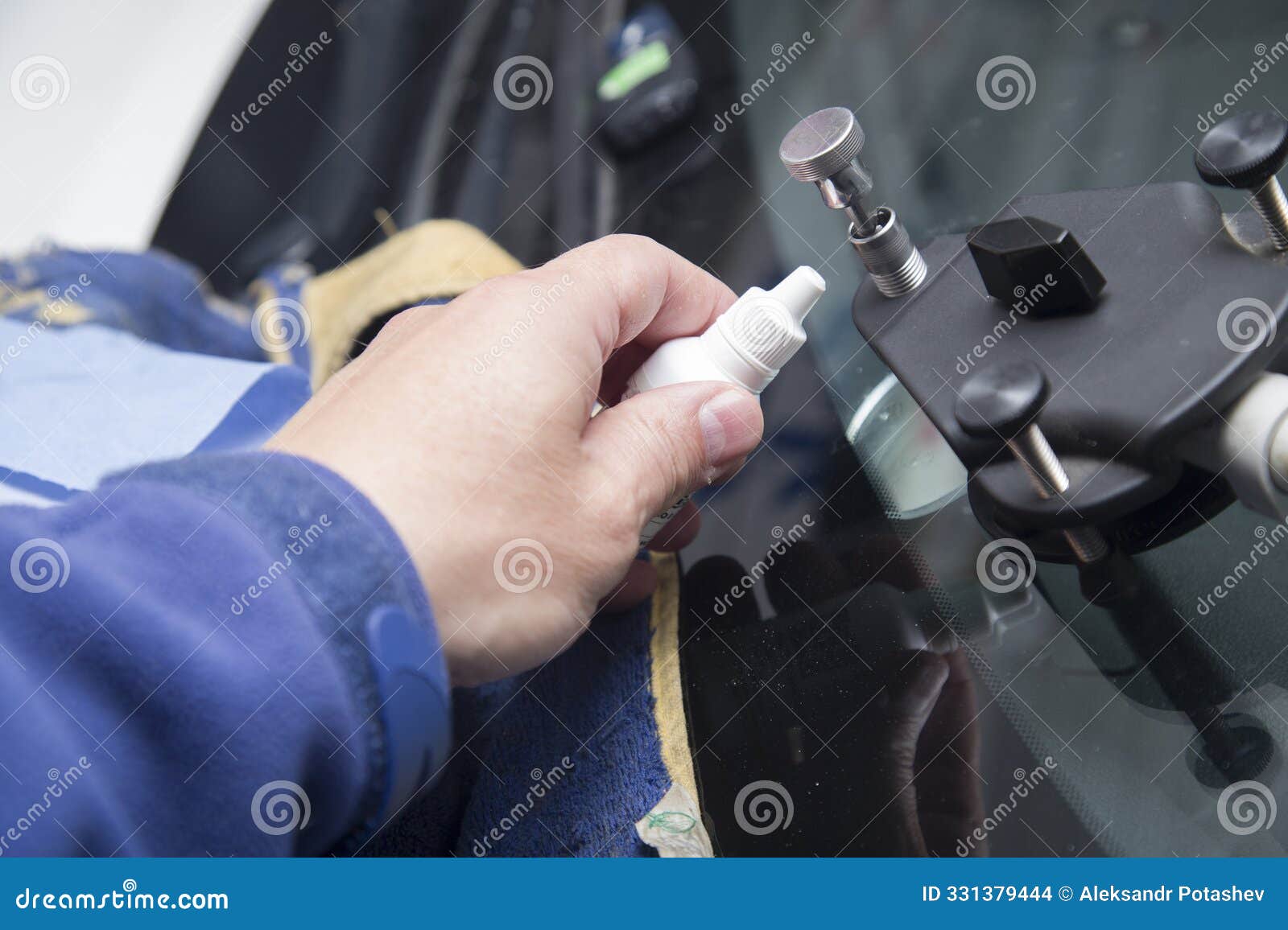 Repair of Chips and Cracks on the Windshield of the Car Stock Photo ...