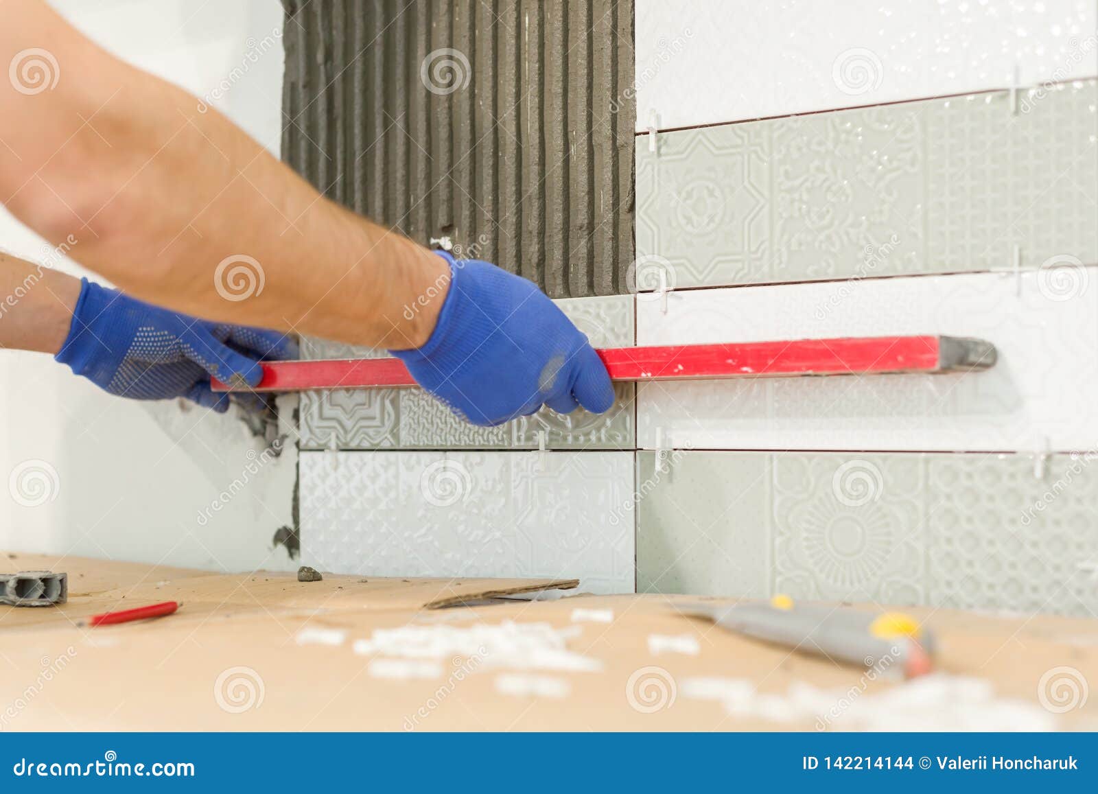 Repair and Construction of the Kitchen, Hands of Tiler Installing ...