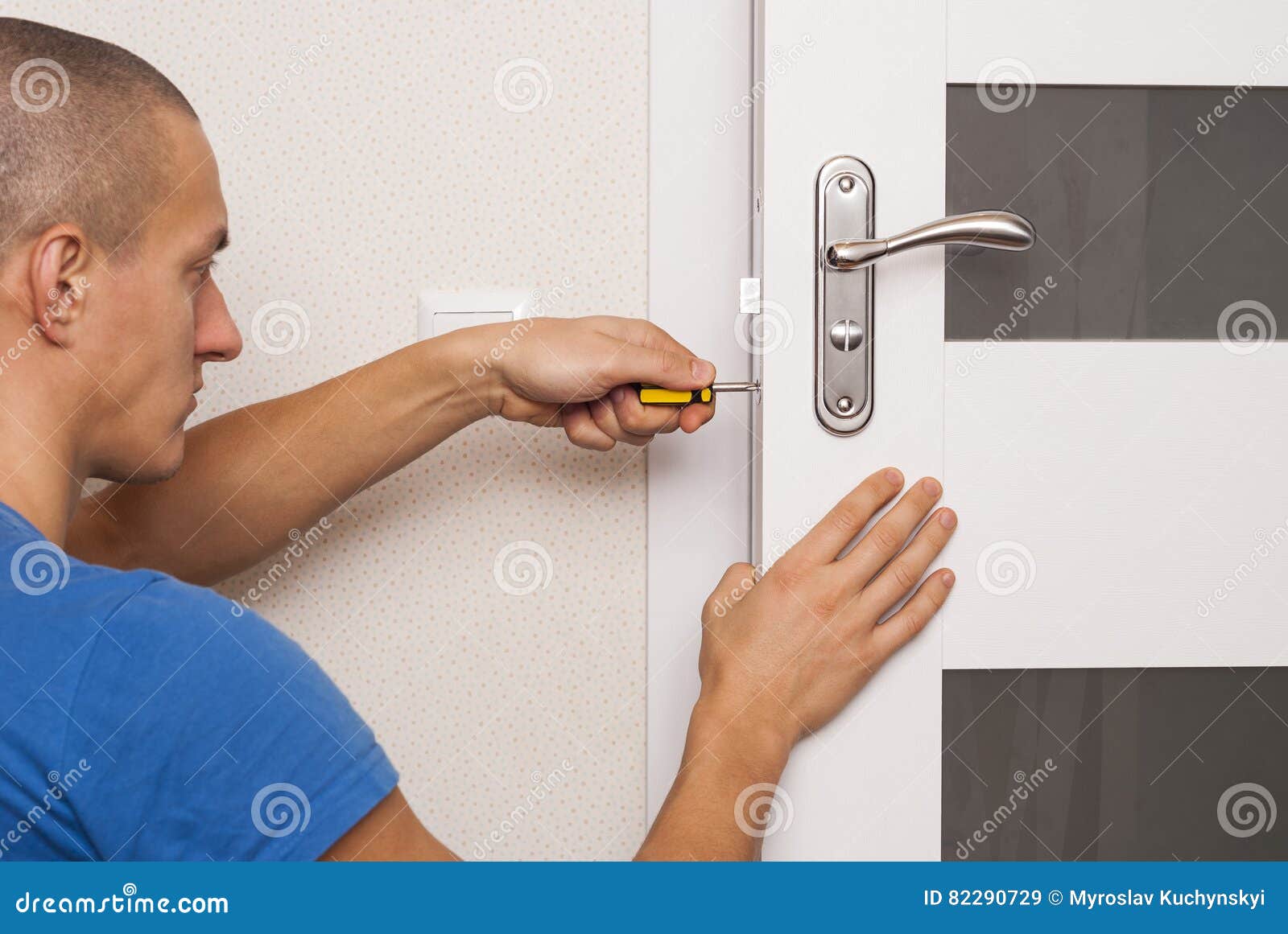 Repair door lock stock image. Image of indoors, male - 82290729