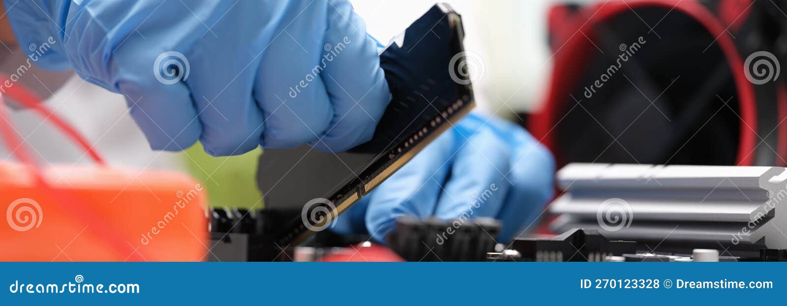 Repair Engineer Holds RAM Chip with Hands and Inserts RAM of Computer ...