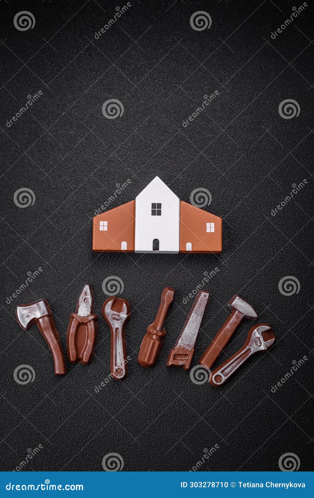 Repair or Home Improvement Tools and a House Model on a Plain ...