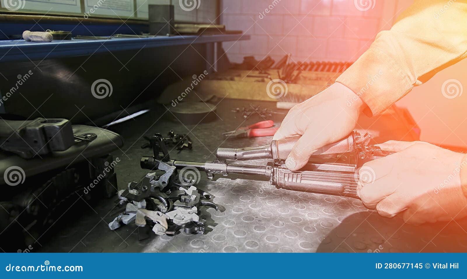 Repair of Small Arms in a Special Workshop. Details in the Hands of a ...