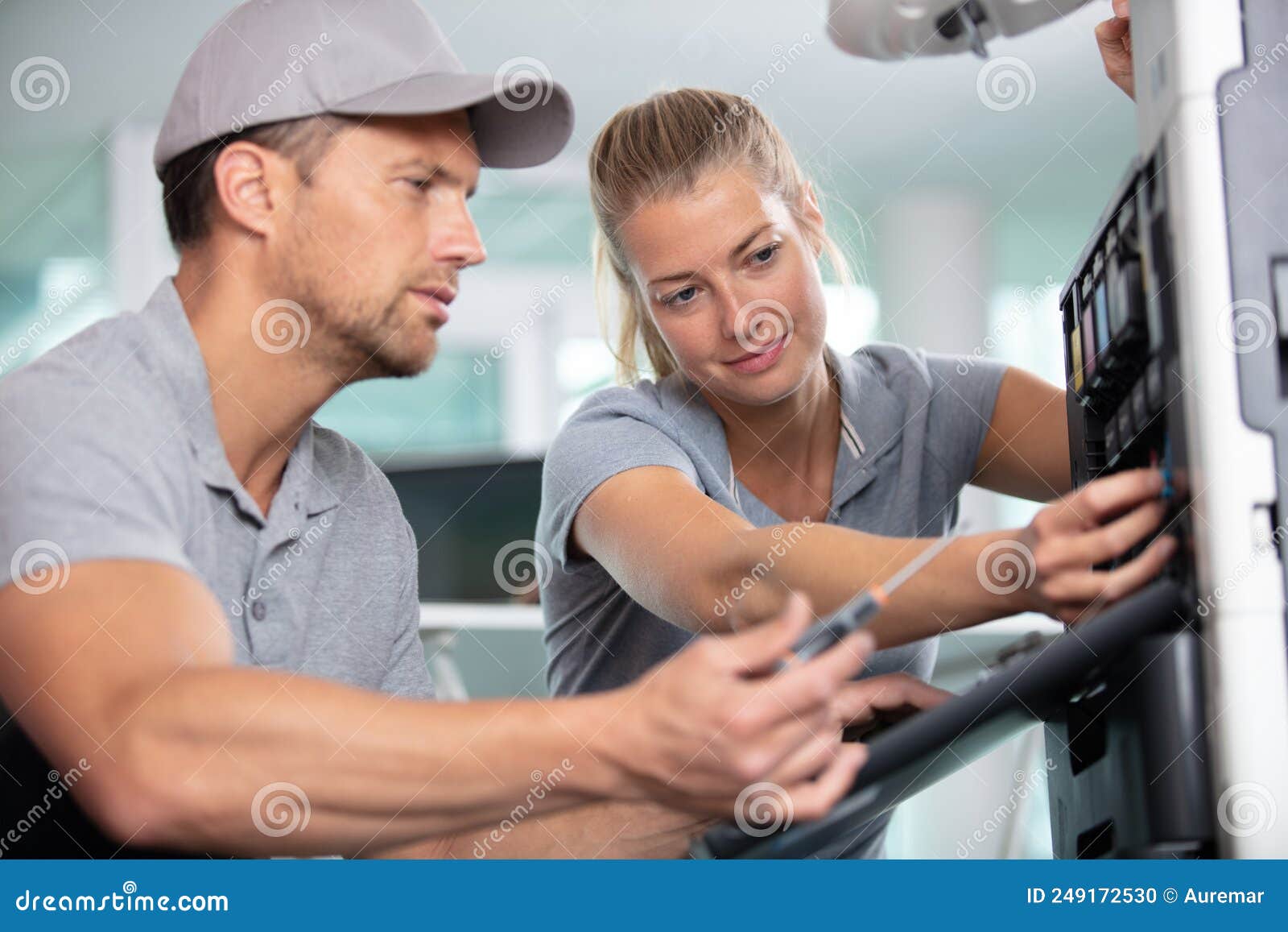Repair Team Working on Industrial Printer Stock Photo - Image of ...