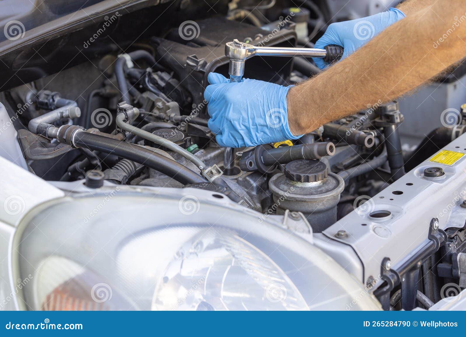 Repair of Vehicle Engine. Car Spark Plug and Ignition Coil Change or ...