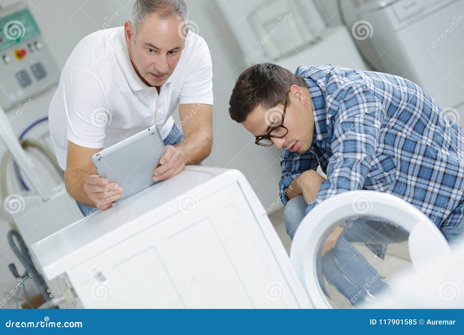 Repair of washing machine stock image. Image of vocational - 117901585