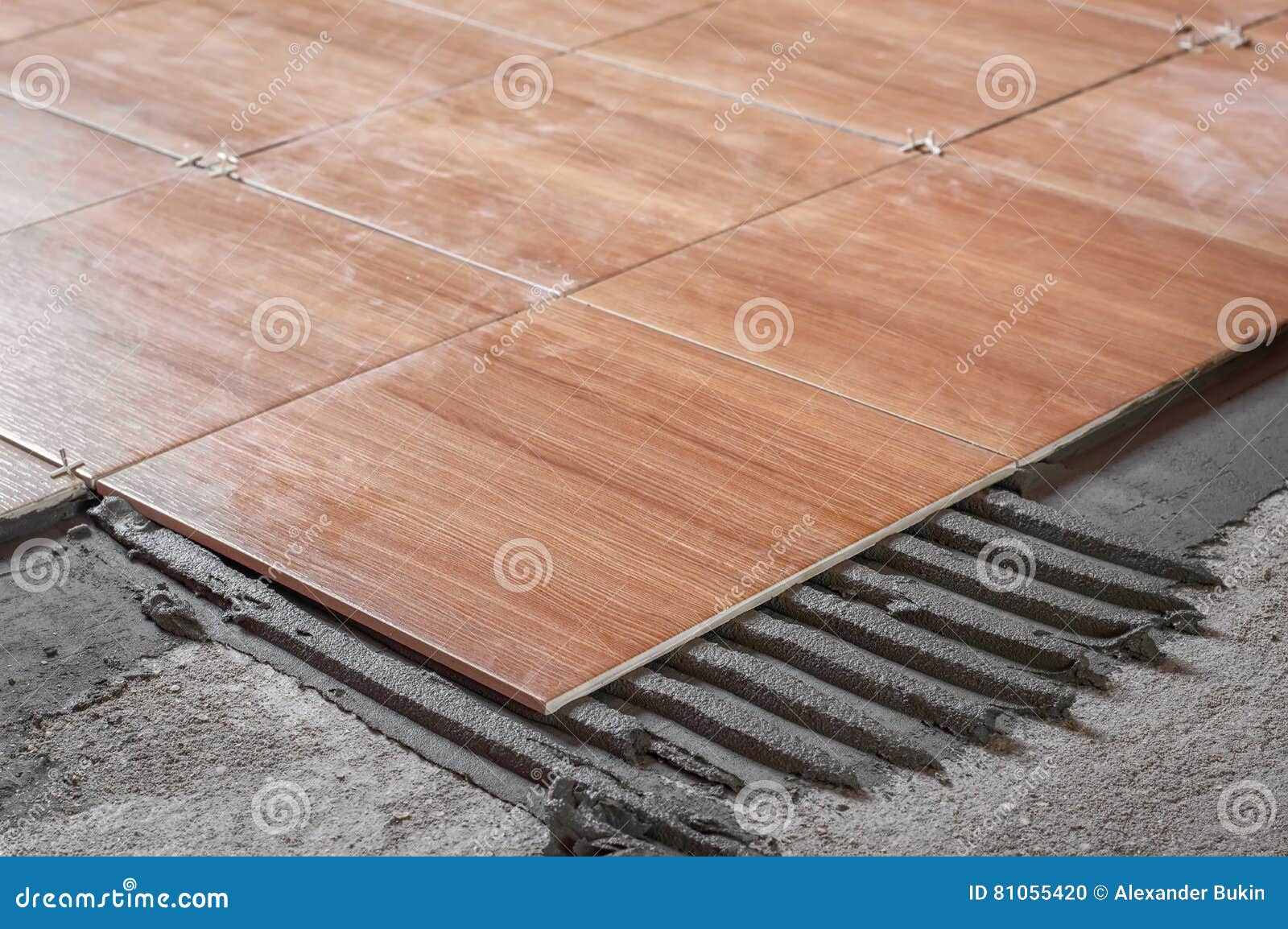 Repair Work, Laying Tiles on the Floor Stock Photo - Image of ...