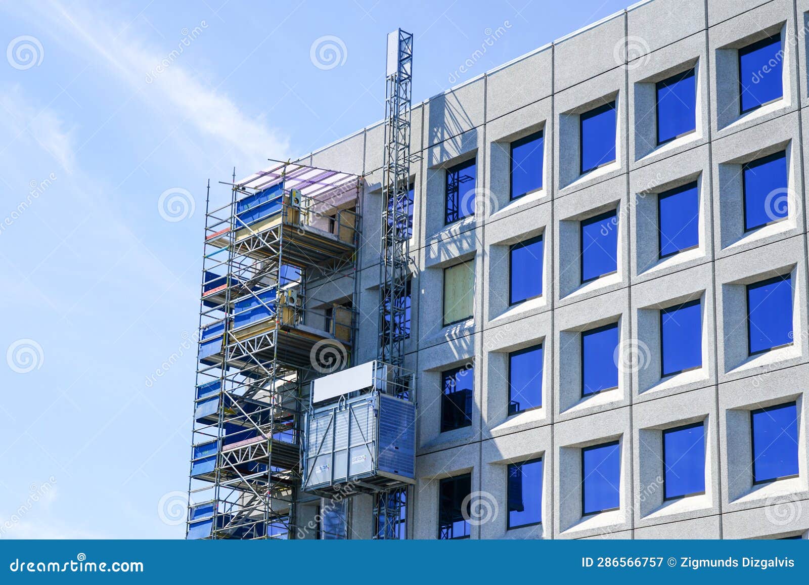 Repair Works of a Modern Office Building Using Scaffolding with ...