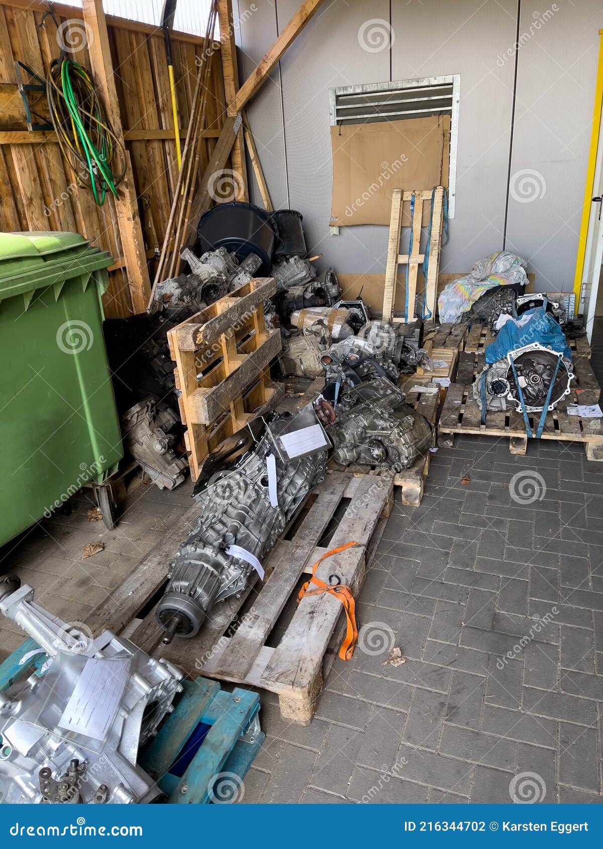 Repaired Engine Gearboxes Lie on Wooden Pallets in the Shed Stock Photo ...