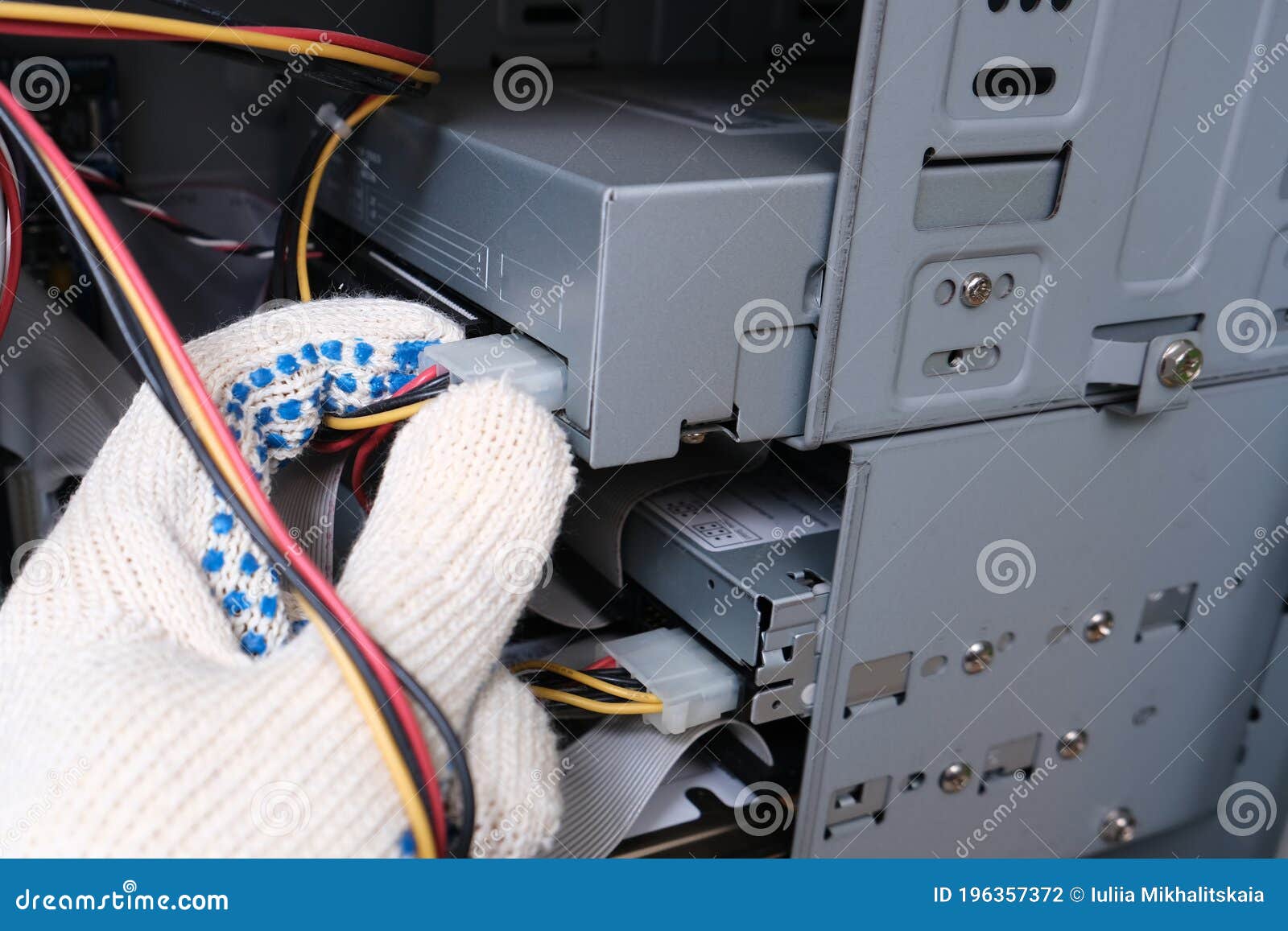 A Repairer Holding a Cable with a Connector Showing a Breakage of a ...