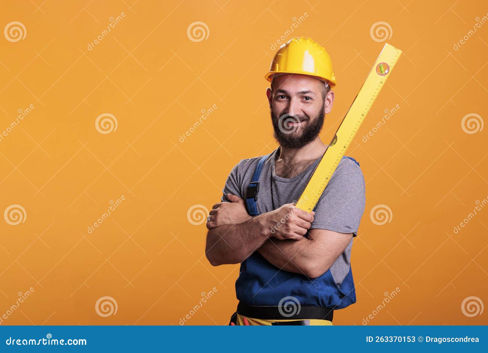 Repairing Constructor Holding Water Level Ruler in Studio Stock Image ...