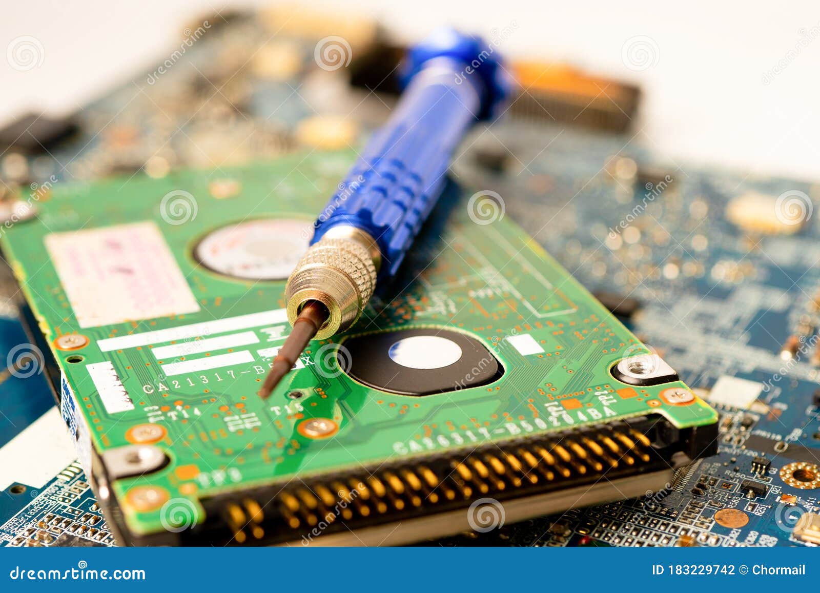 Repairing Inside of Hard Disk by Soldering Iron. Integrated Circuit ...