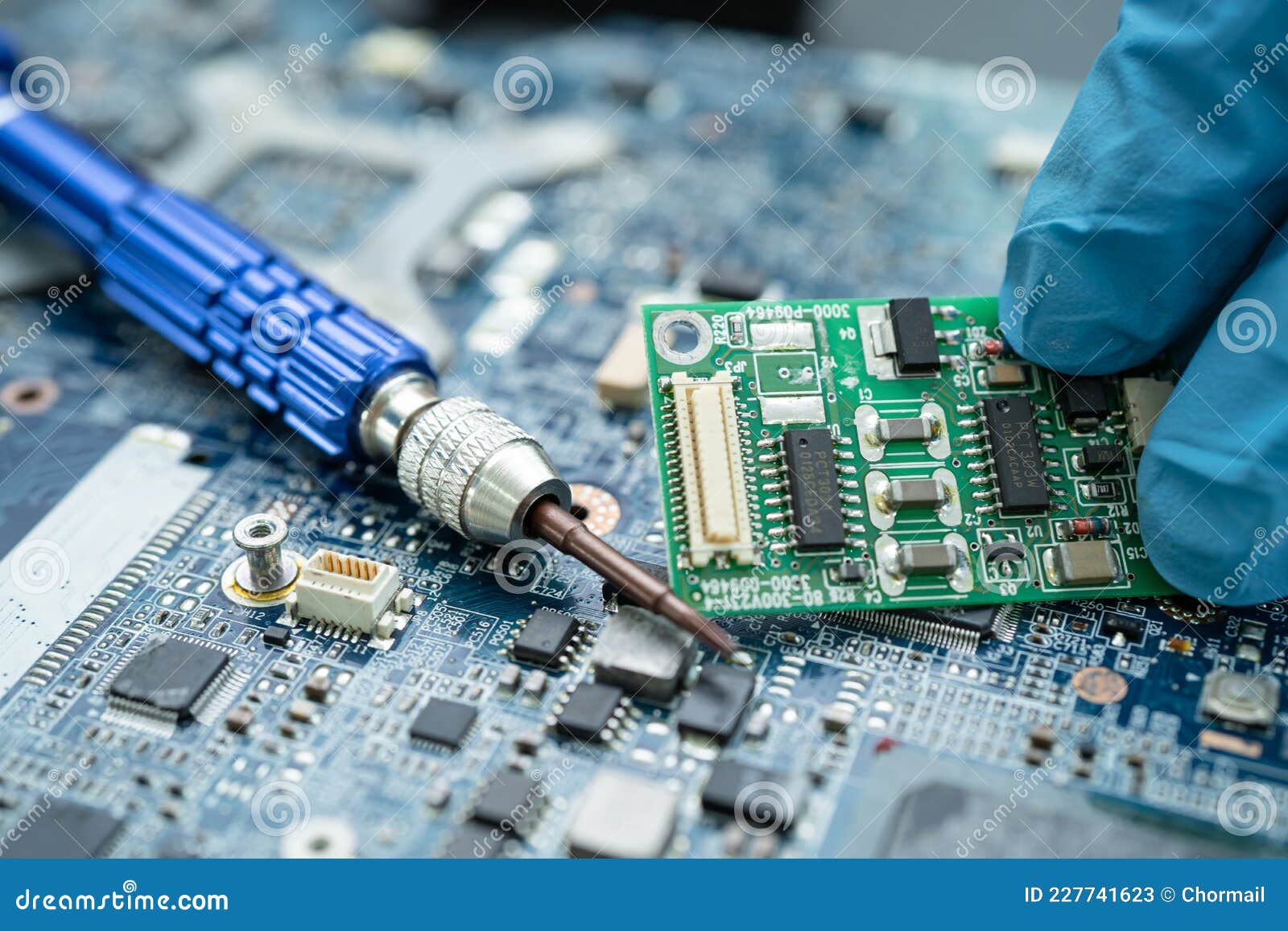 Repairing Inside of Hard Disk by Soldering Iron. Integrated Circuit ...
