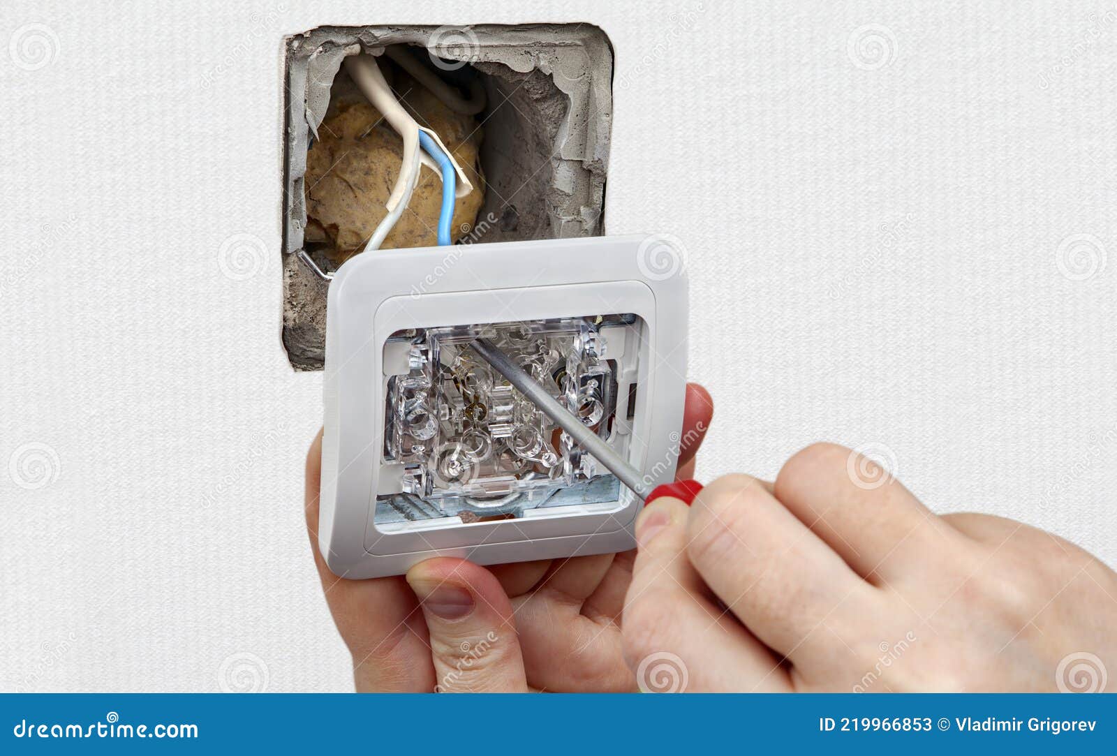 Repair of an Electrical Outlet or Light Switch in Apartment. Stock ...