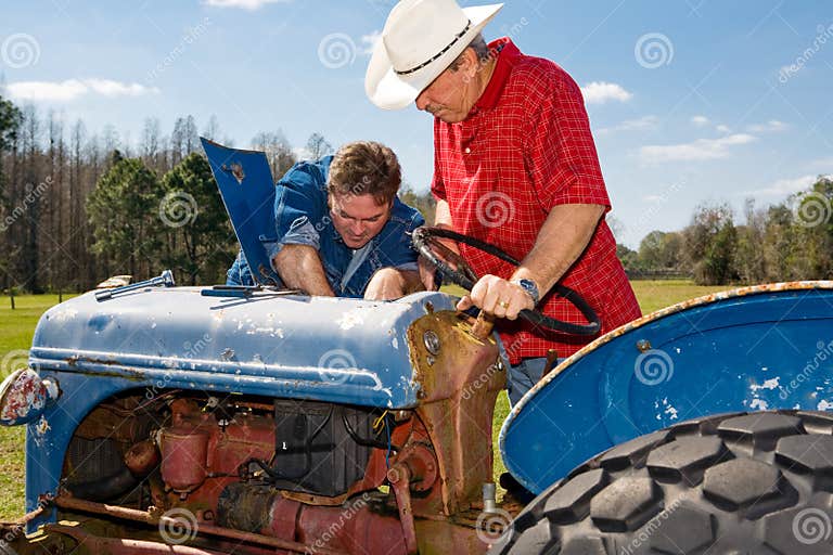 Repairing the Old Tractor stock photo. Image of farm, confident - 4989860