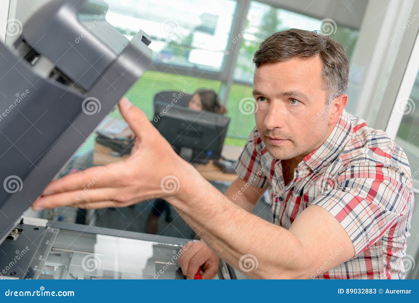 Repairing printer at work stock image. Image of male - 89032883
