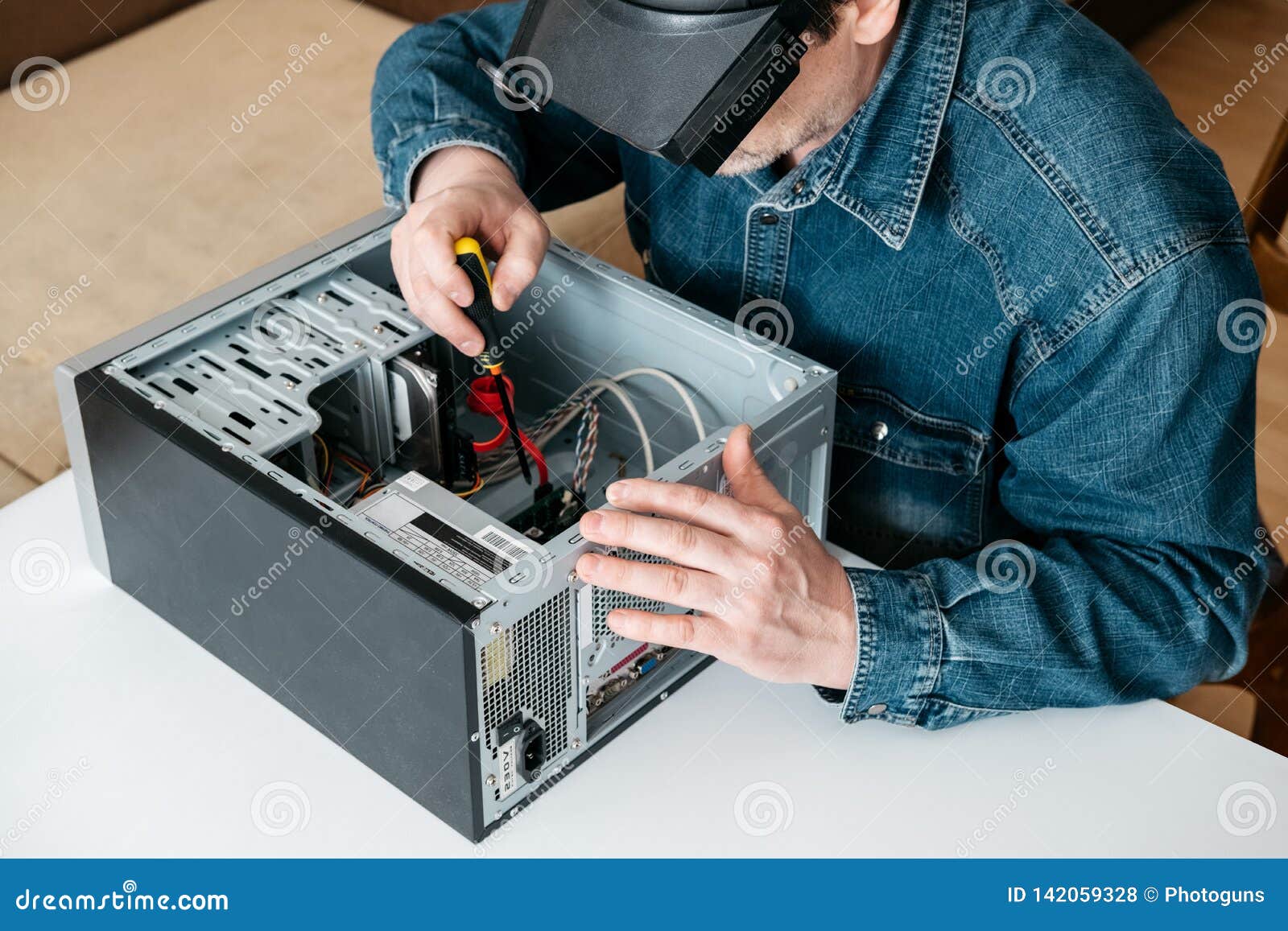 Repairman is Disassembling Personal Computer. Engineer is Diagnostic ...