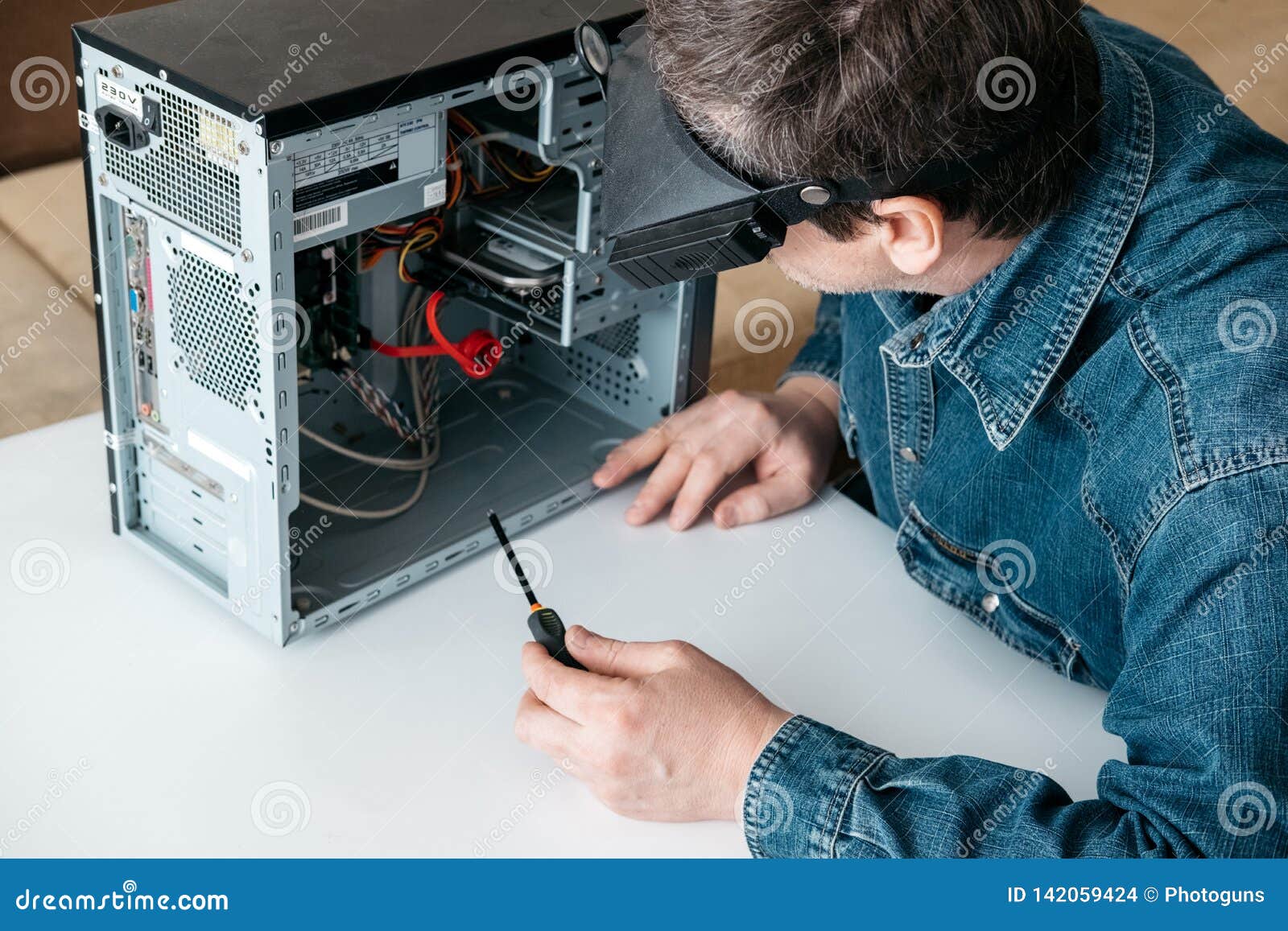 Repairman is Disassembling Personal Computer. Engineer is Diagnostic ...