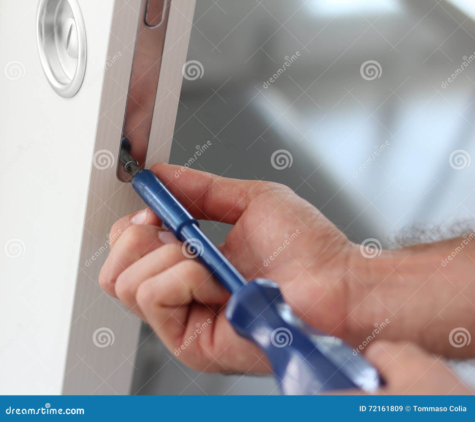 Repairman Fixing a Door Lock Stock Image - Image of renovation ...