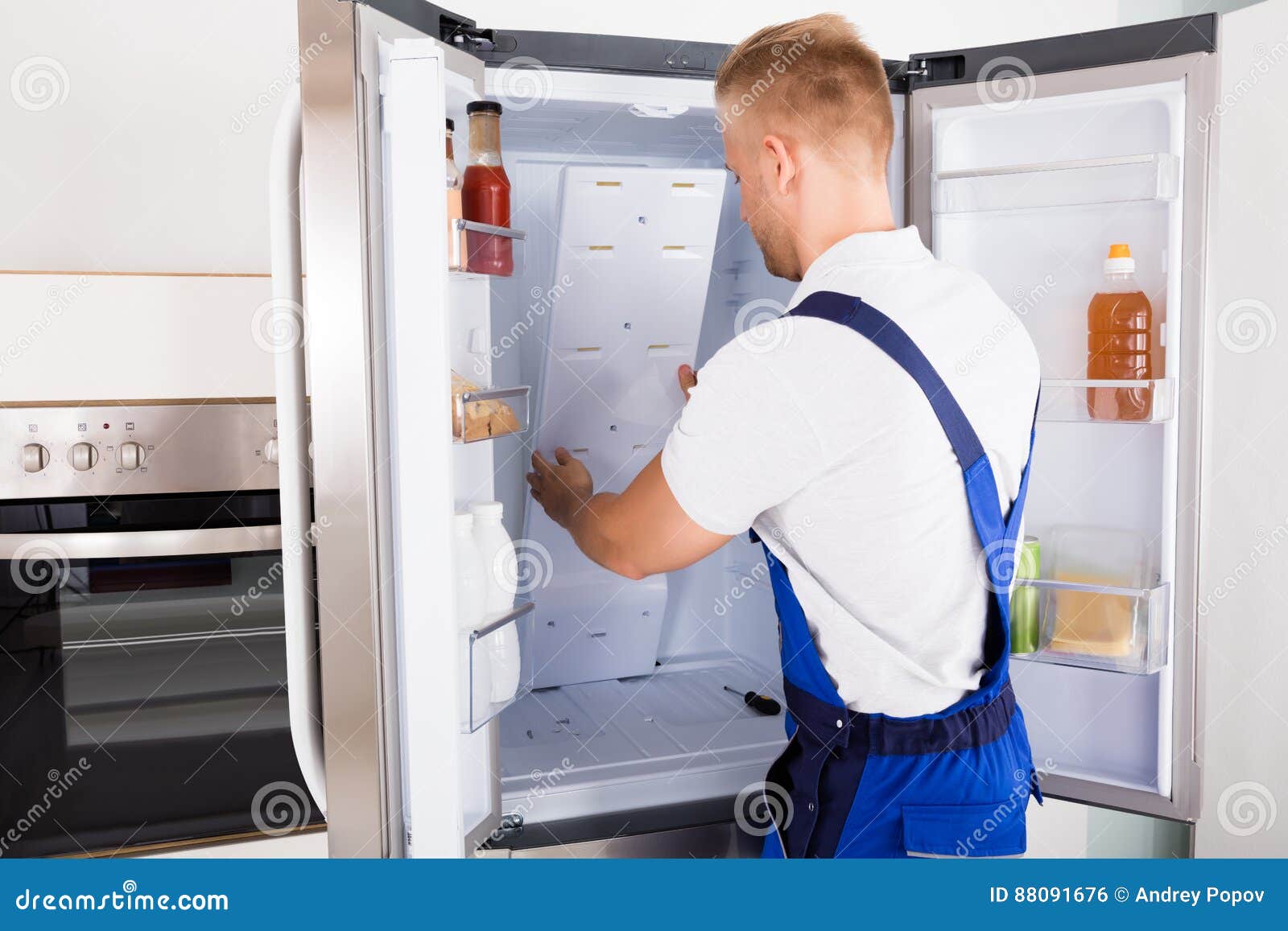 Repairman Fixing Refrigerator Stock Photo - Image of fridge, fixing ...