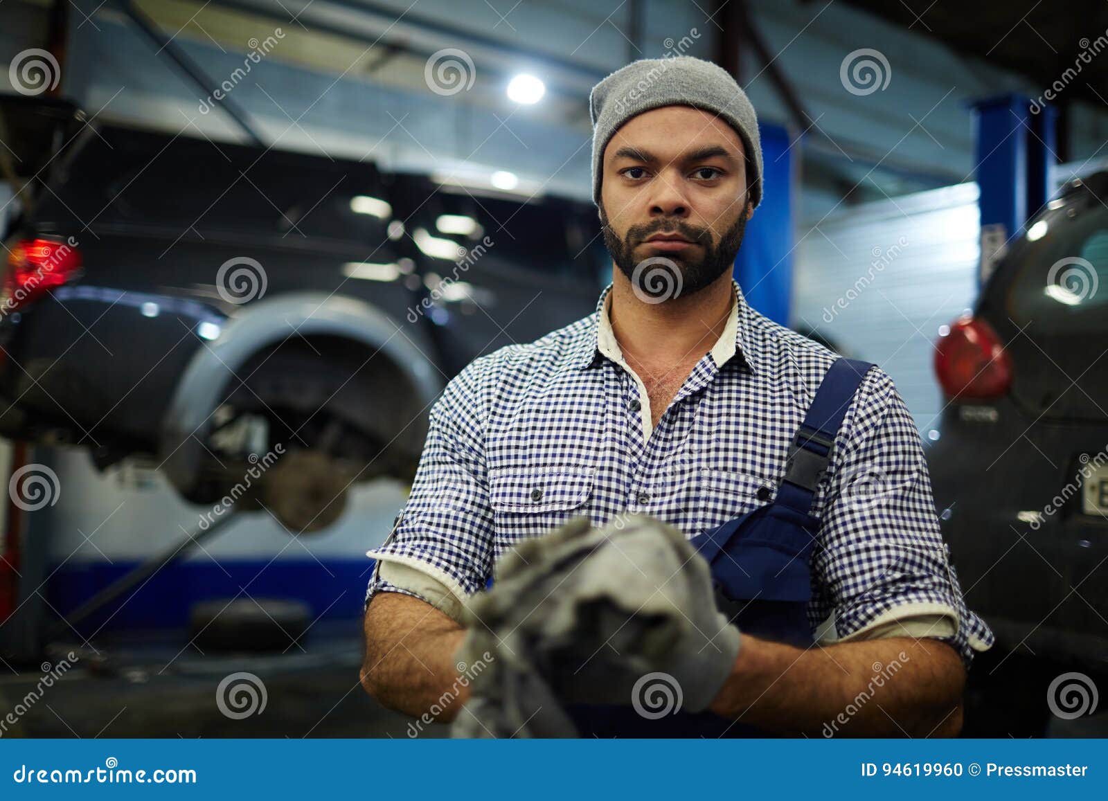 Repairman in garage stock photo. Image of mechanic, owner - 94619960