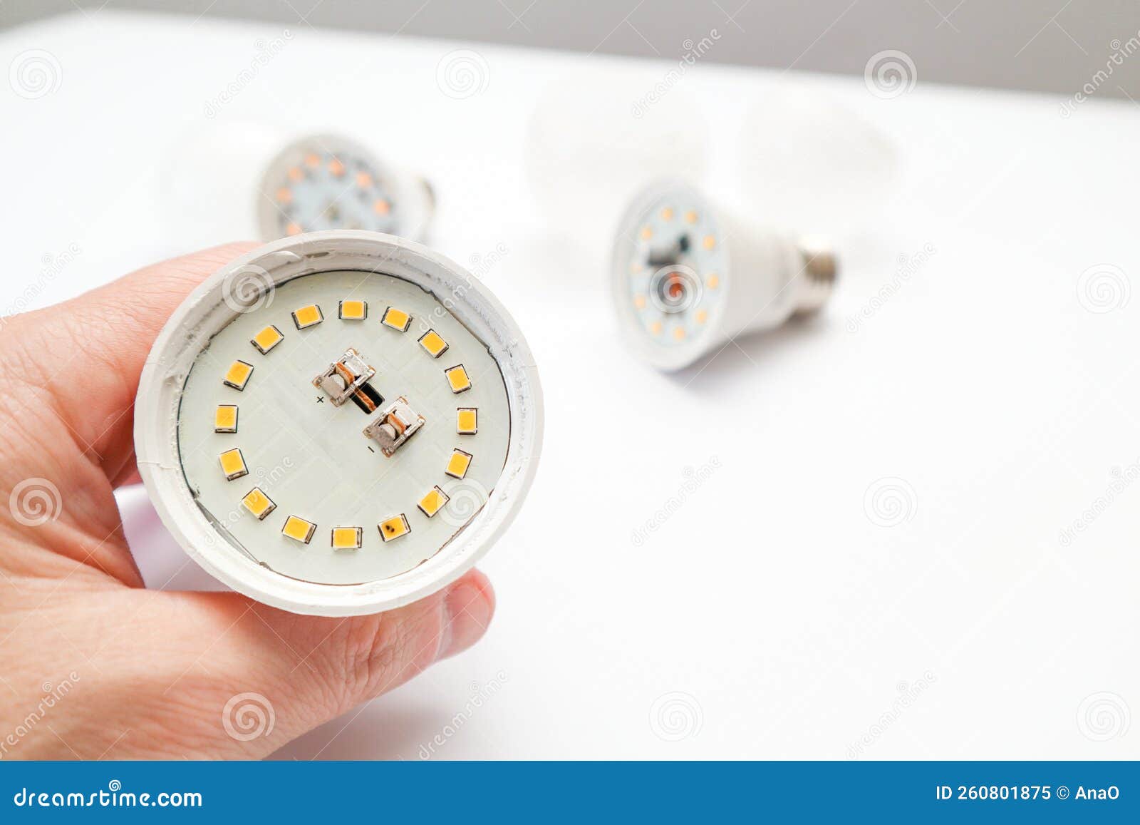 Repairman Hand Holding the Broken White LED Lamp, Isolated on White ...