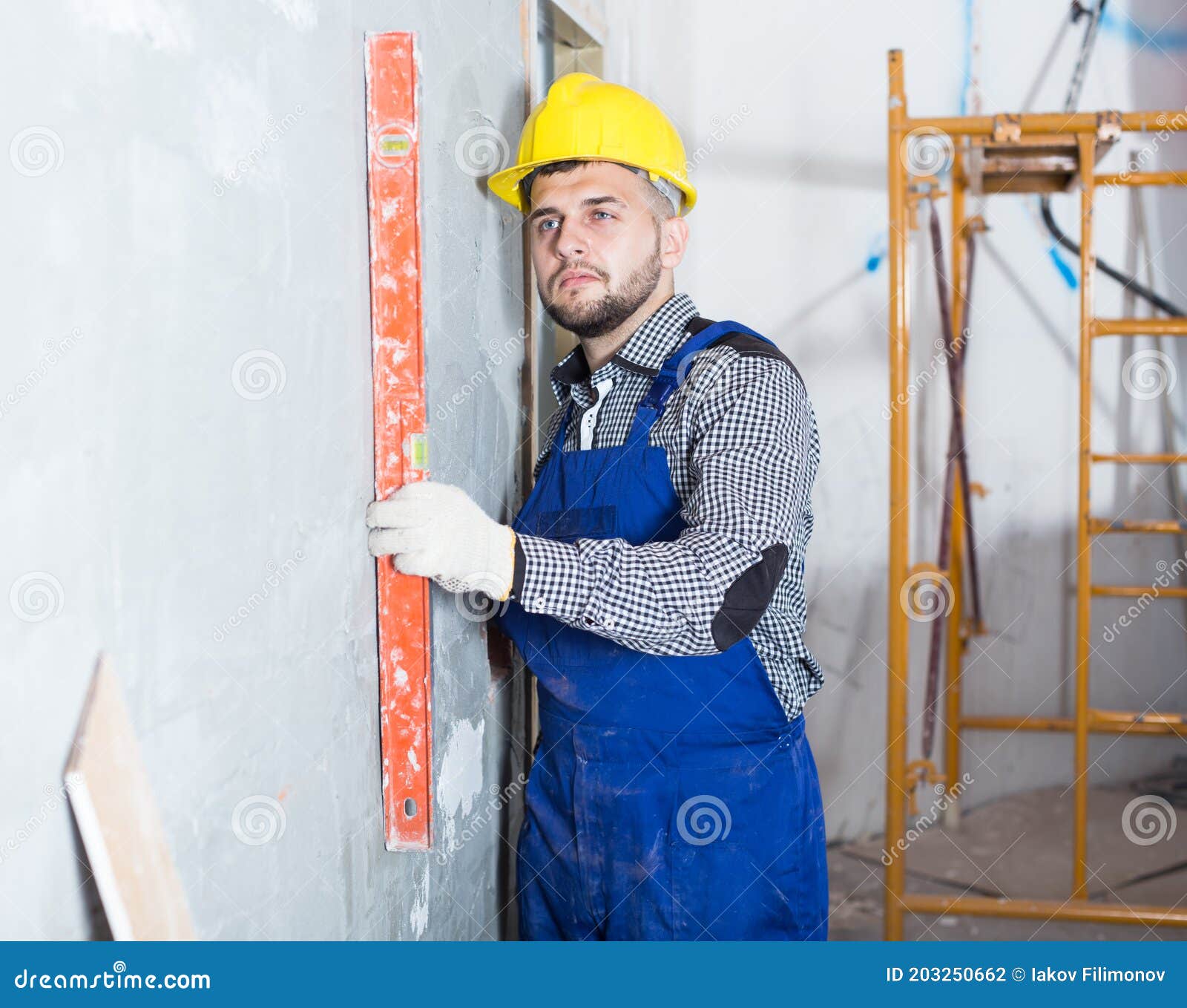 Repairman in Helmet is Measuring Wall Stock Photo - Image of hardhat ...