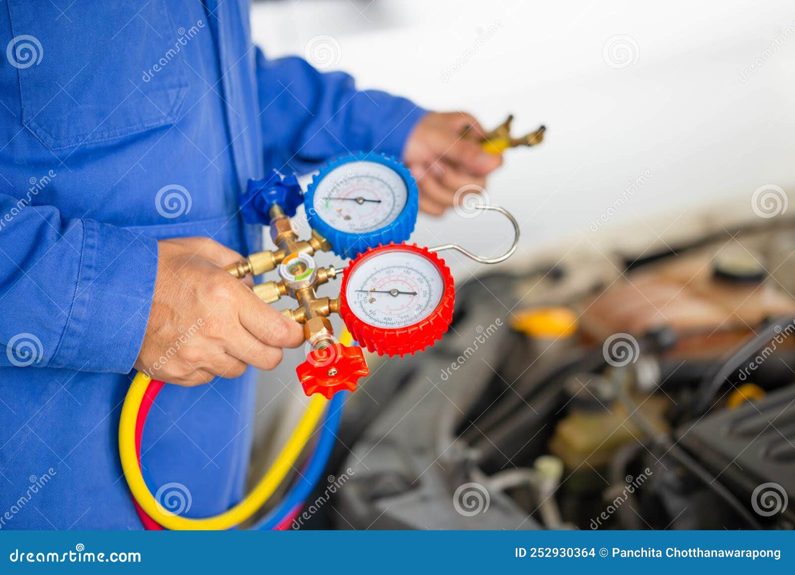 Repairman Holding Monitor Tool To Check and Fixed Car Air Conditioner ... Repairman Holding Monitor Tool To Check and Fixed Car Air Conditioner ...