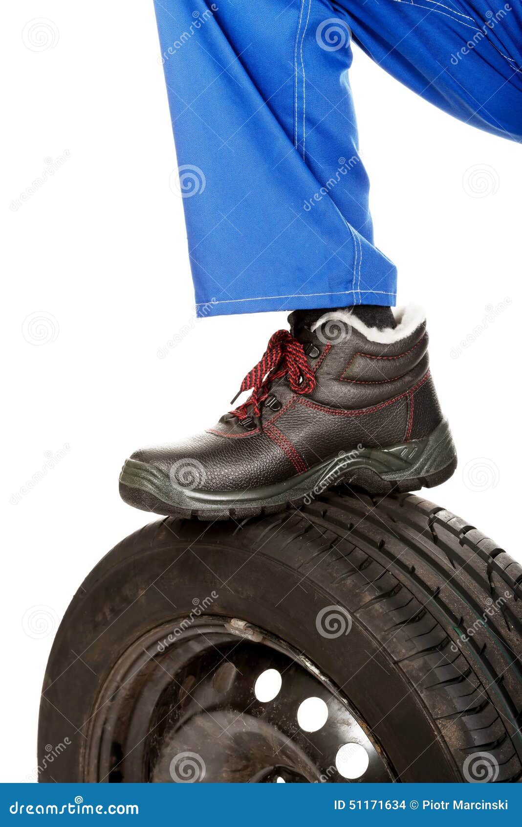 Repairman leg on a tire stock photo. Image of closeup - 51171634