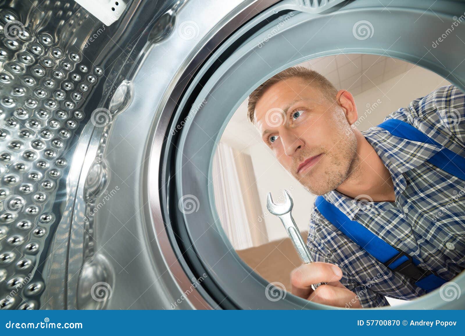 Repairman Looking Inside the Washing Machine Stock Photo - Image of ...