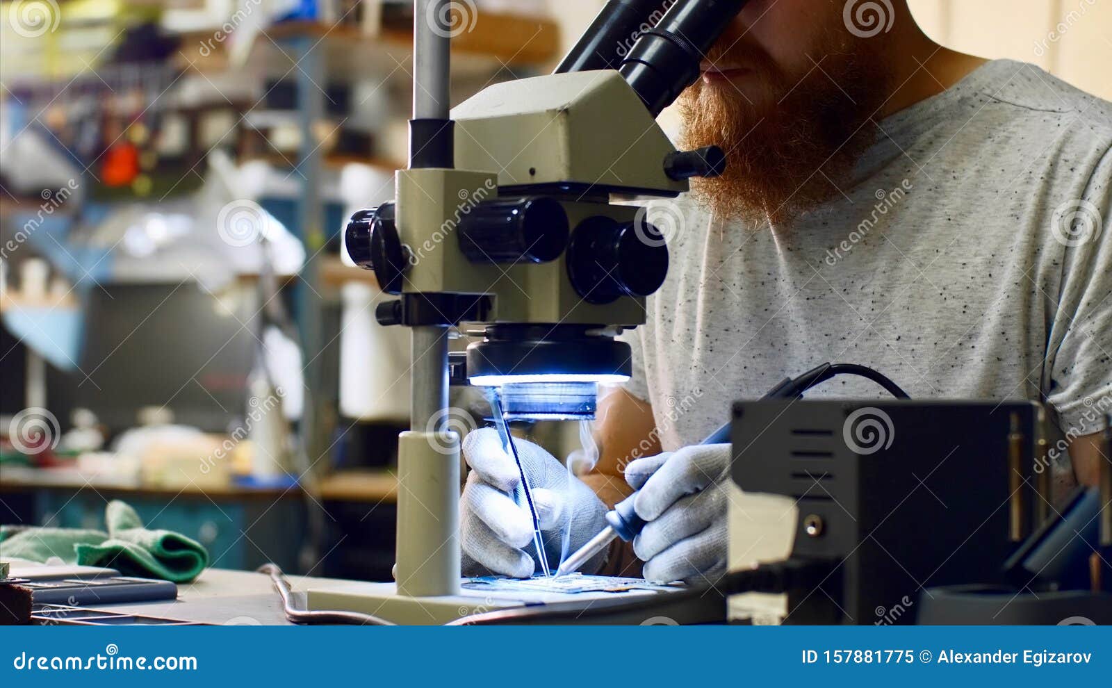 Repairman Looks through Microscope Produces Solders on Circuit Board of ...