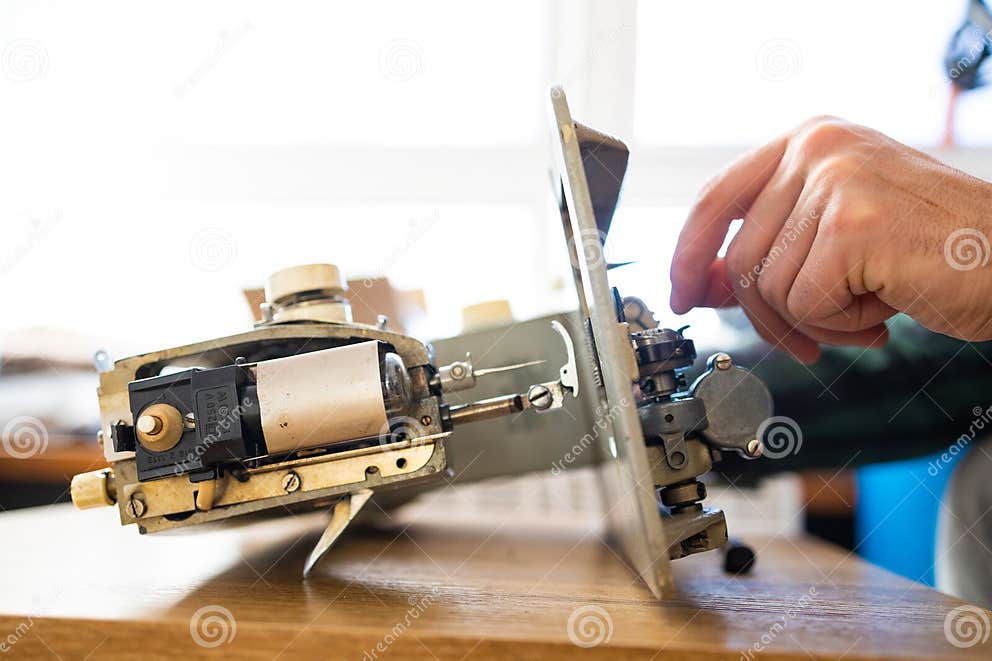 Repairman Master is Testing Old Disassembles Sewing Machine in Workshop ...